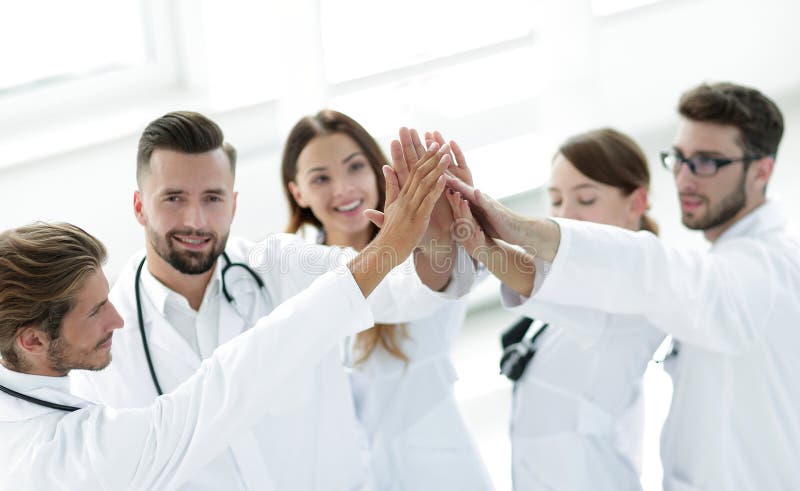 Group of Doctors Giving Each Other a High Five. Stock Image - Image of ...