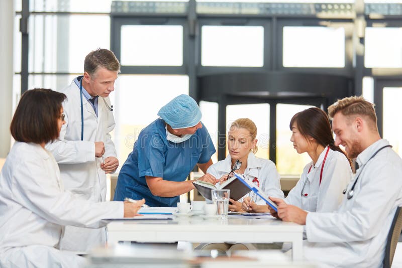 Group Doctors in a Meeting Discussing Appointments Stock Photo - Image ...