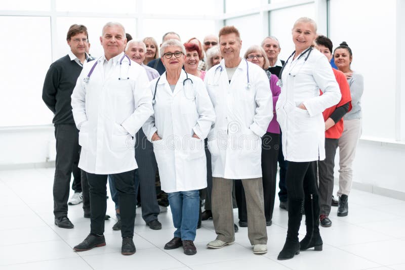A Group of Doctors and Patienst Standing in Hospital Stock Photo ...
