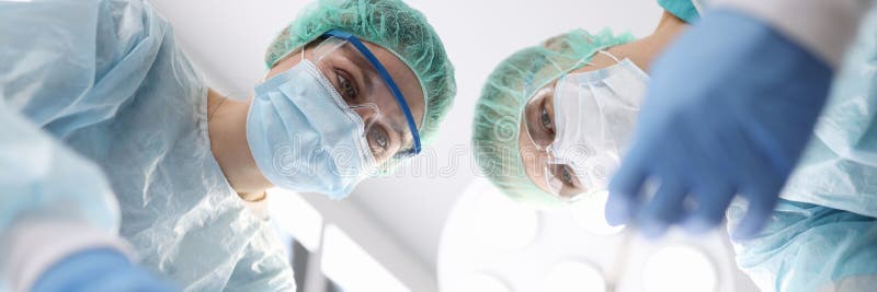 Group of Doctors Performing Surgical Operation in Clinic Stock Photo ...