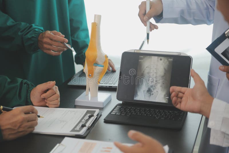 Group of Doctors Reading a Document in Meeting Room at Hospital Stock ...