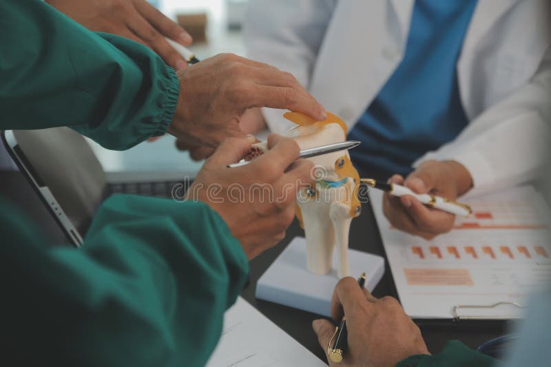 Group of Doctors Reading a Document in Meeting Room at Hospital Stock ...