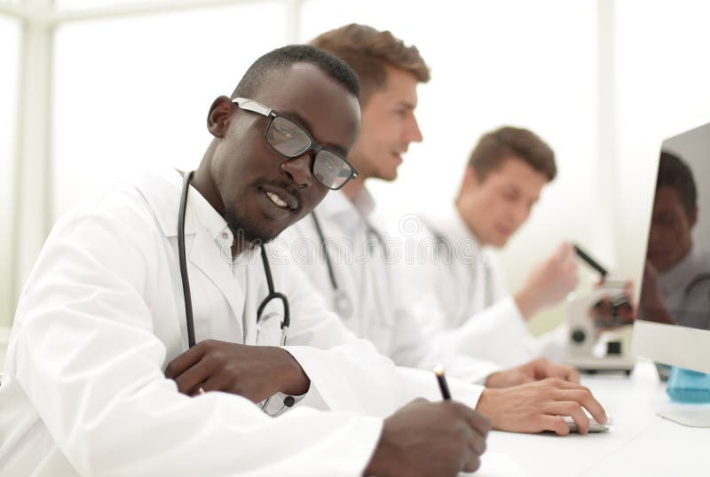 Group of Doctors Sitting in the Laboratory Stock Photo - Image of ...
