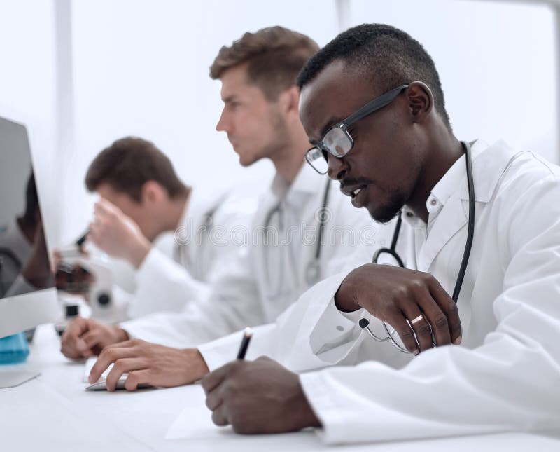 Group of Doctors Sitting in the Laboratory Stock Image - Image of ...