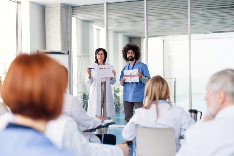 Group of Doctors Talking about Corona Virus on Conference. Stock Photo ...