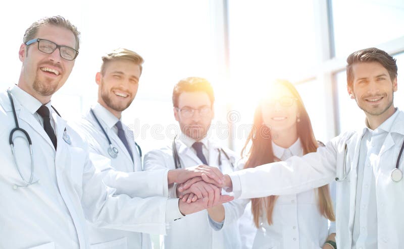 Group of Doctors with Their Hands Folded Together Stock Photo - Image ...