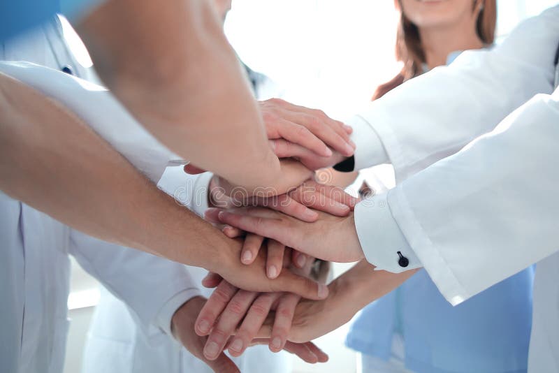 Group of Doctors with Their Hands Folded Together Stock Image - Image ...