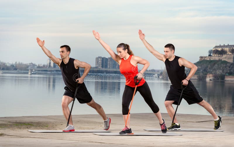 Group Doing Exercise with Resistance Rubber Stock Photo - Image of ...