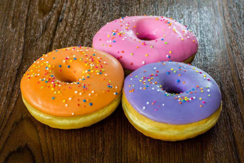 Group of donuts on wood stock image. Image of assorted - 42849465