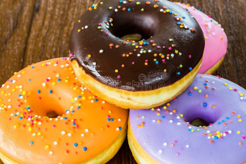Group of donuts on wood stock photo. Image of diet, assorted - 42849502