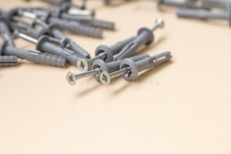 A Group of Dowels and Nails on a Yellow Background Stock Photo - Image ...