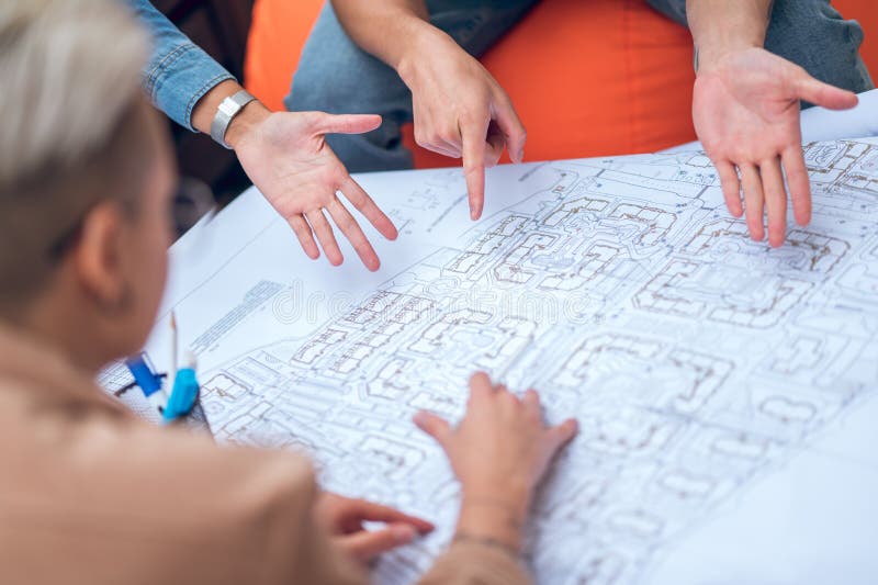 Group of Draftspeople Working on a Drawing Stock Image - Image of ...