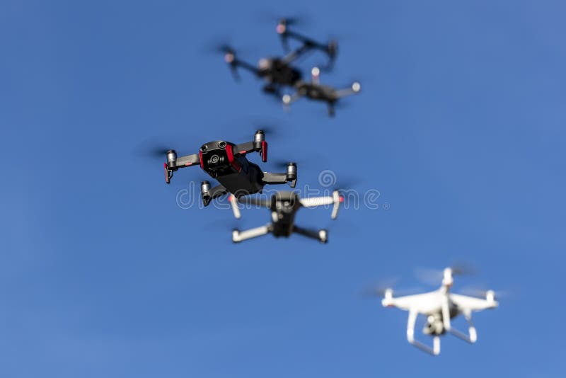 Squadron flying drones stock image. Image of helicopter - 63007279