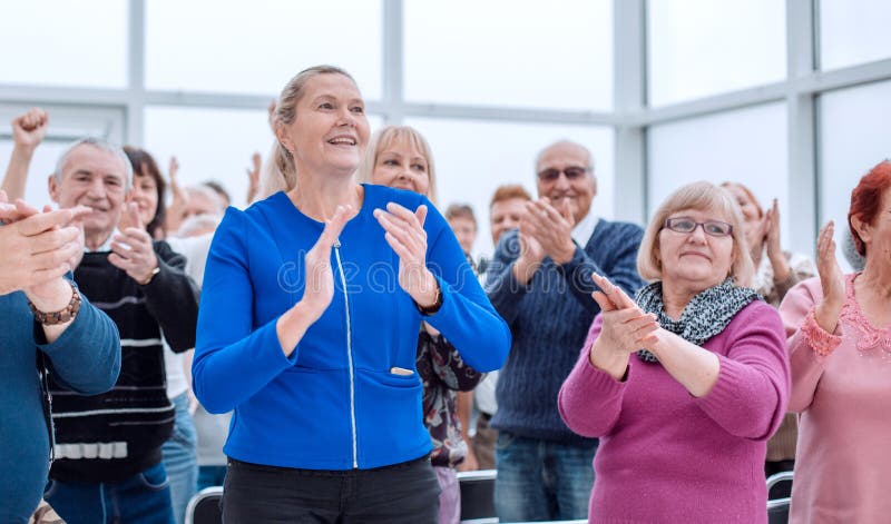 A Group of Elderly People are Sitting in a Circle Clapping Their Stock ...