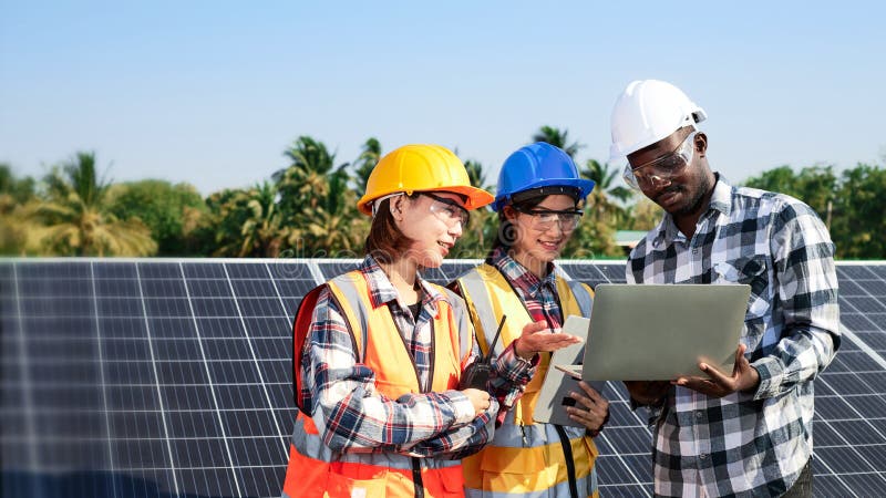 A Group of Electrical Engineers is Working Outdoors in the Solar Panel ...