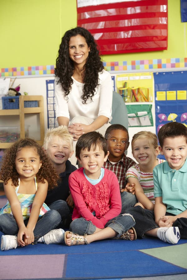 Group of Elementary Age Schoolchildren in Class with Teacher Stock ...