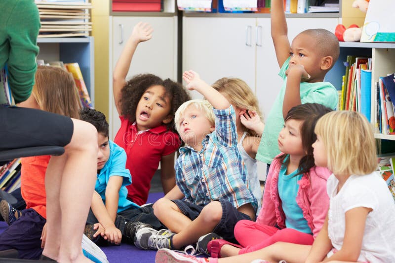 Group of Elementary Pupils in Classroom Answering Question Stock Photo ... Group of Elementary Pupils in Classroom Answering Question Stock Photo ...