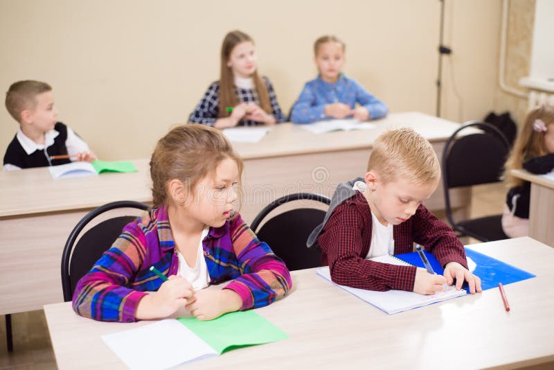 Group of Elementary Pupils in the Classroom. Stock Image - Image of ... Group of Elementary Pupils in the Classroom. Stock Image - Image of ...