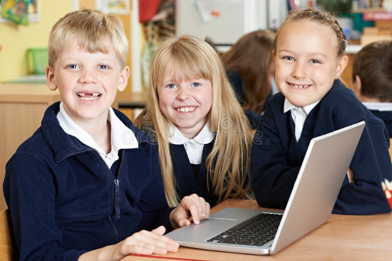 Group of Elementary School Children Working Together in Computer Stock ...