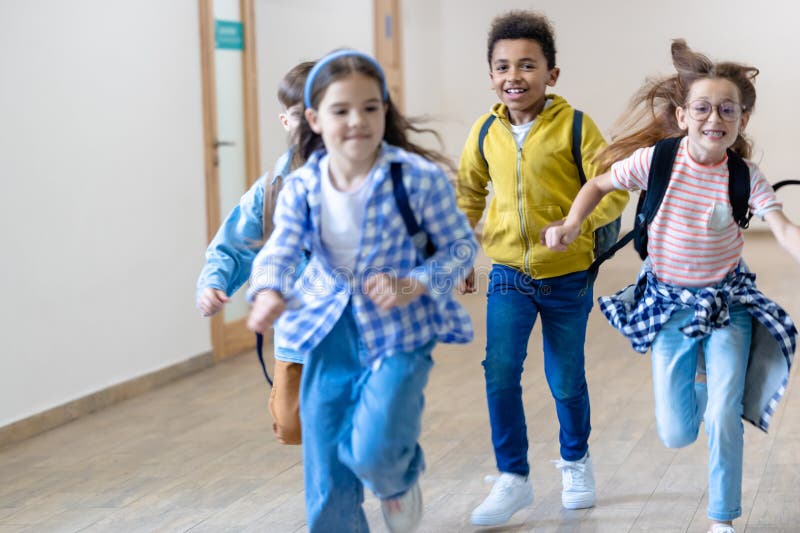 Group of Elementary School Kids Running in School Corridor. Stock Photo ...