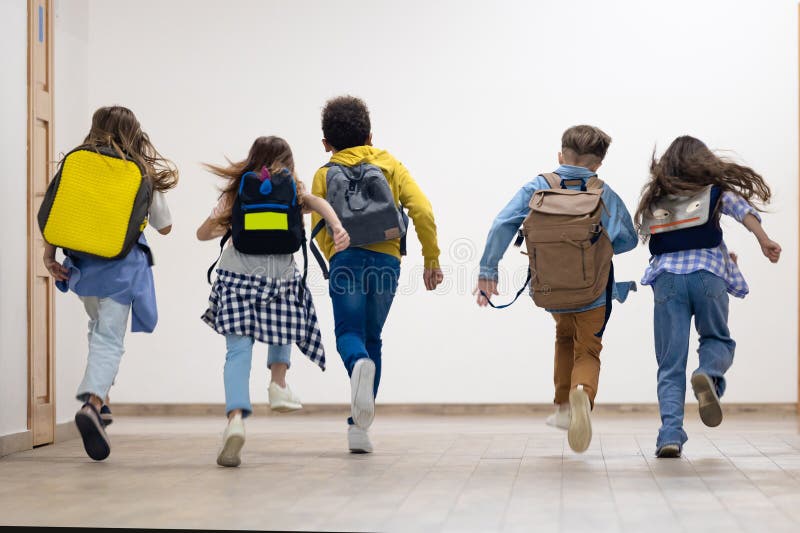 Group of Elementary School Kids Running in School Corridor. Stock Photo ...