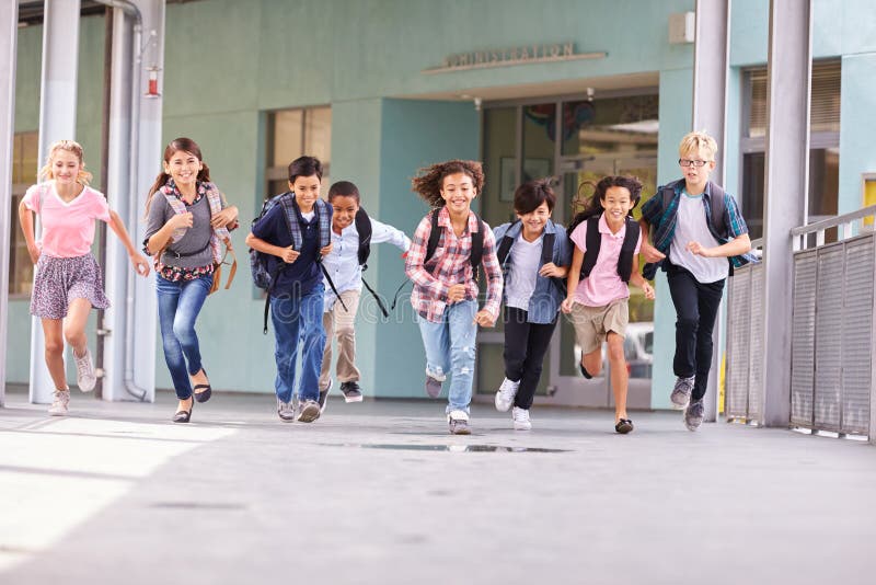 Group of Elementary School Kids Running in a School Corridor Stock ...