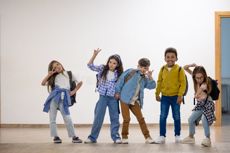 Group of Elementary School Kids Standing in School Corridor. Stock ...