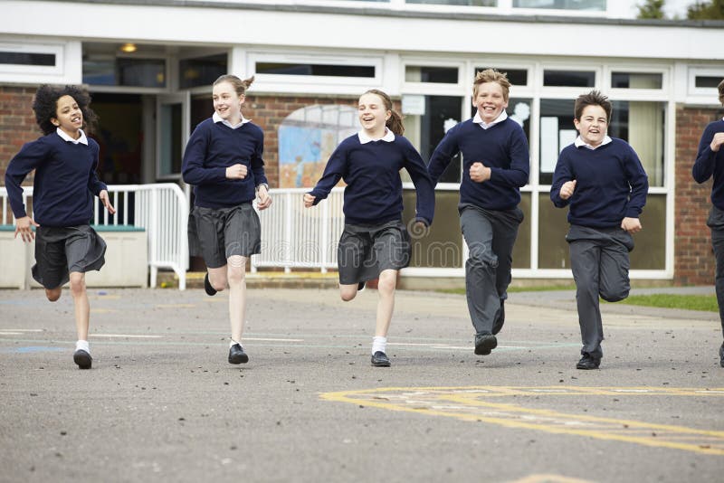Group of Elementary School Pupils Running in Playground Stock Image ...