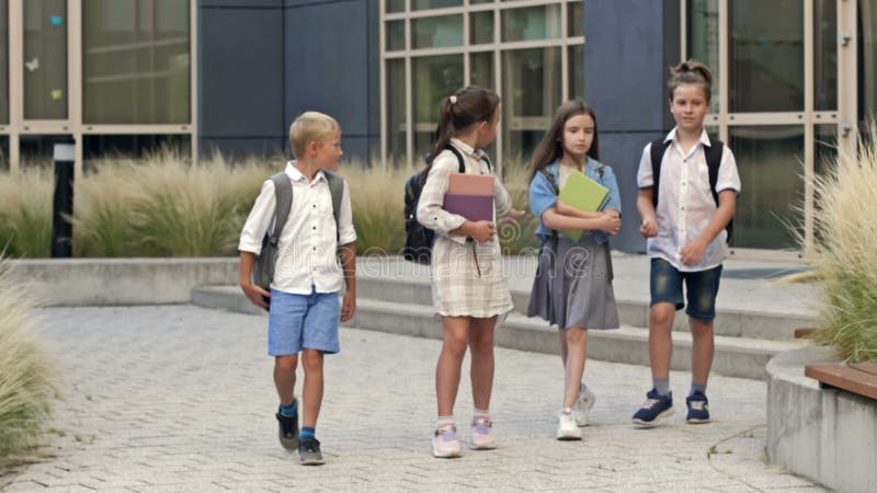 Group of Elementary School Students Joyfully Run Out of the School ...