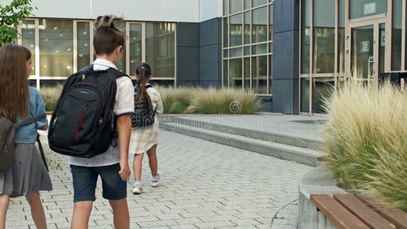 Group of Elementary School Students Rush To a Lesson To School. Back To ...