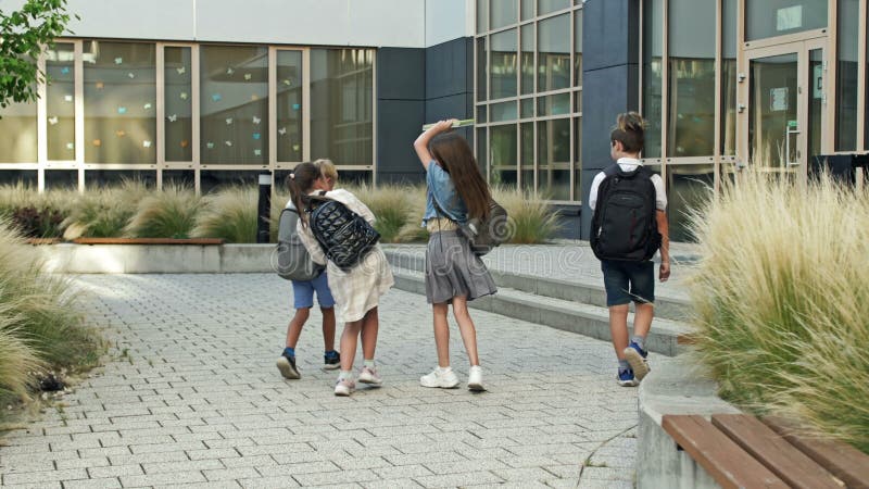 Group of Elementary School Students Rush To a Lesson To School. Back To ...