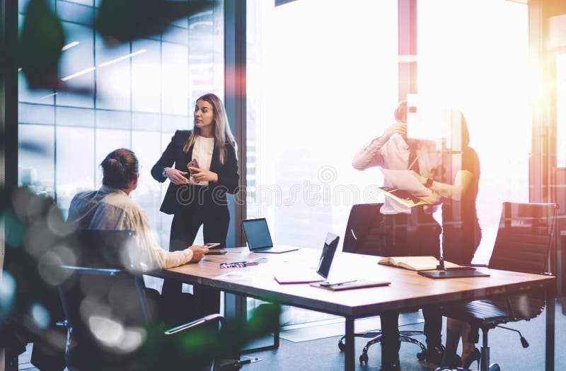 Group of Employees Cooperating and Collaborating in Conference Room of ...