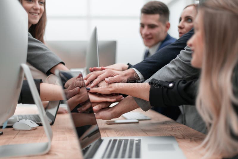 Group of Employees Forming a Stack of Hands on the Desktop Stock Image ...