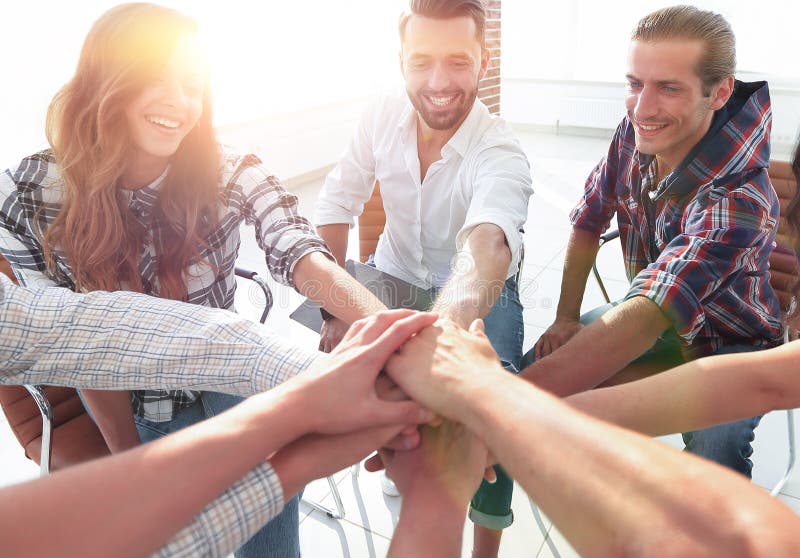 Group of Employees with Hands Clasped Together. Stock Image - Image of ...