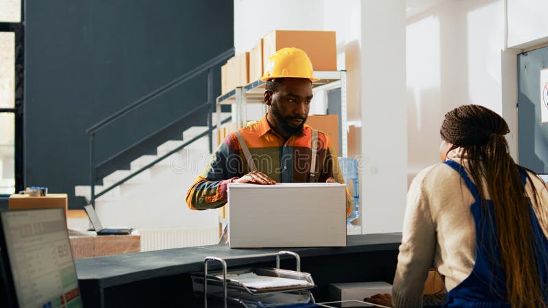 Group of Employees Talking about Boxes of Goods Stock Image - Image of ...