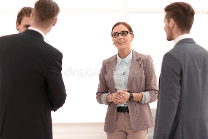 Group of Employees Talking while Standing in the Office Stock Photo ...