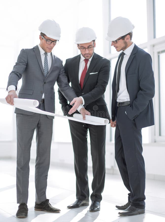 Group Engineer Discussing Blueprint of New Project Stock Photo - Image ...