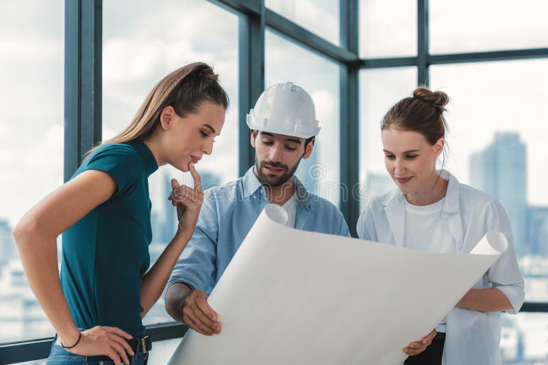 Group of Engineer Looking at Project Plan while Brainstorming Idea. Tracery. Stock Image - Image ...