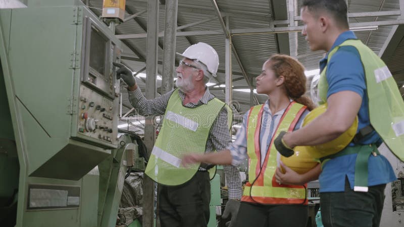 Group of Engineer Talking and Training Working Using Machine Control ...
