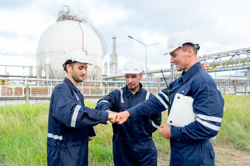 Group of Engineer or Technician Workers Stand in Front of Tank in ...