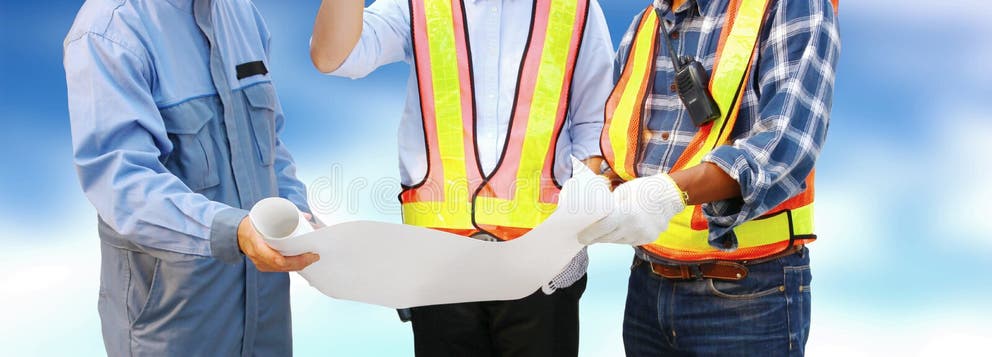 Group of Engineer with White Plan in Hand Comment on Work Stock Image ...