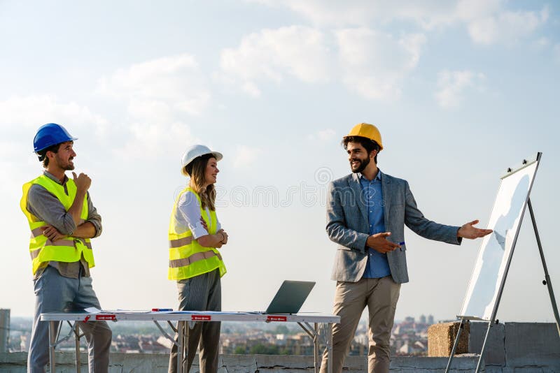 Group of Engineers, Architects, Business Partners at Construction Site ...