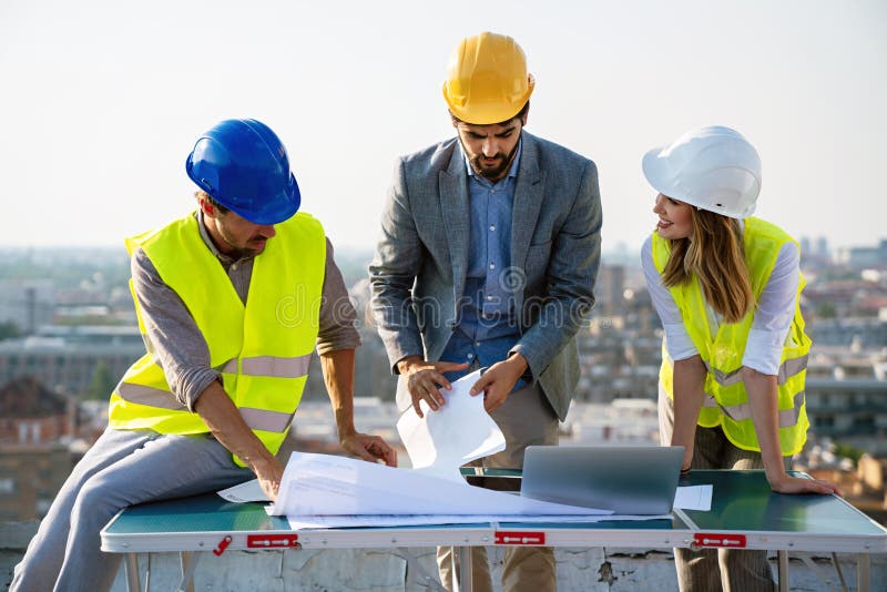 Group of Engineers, Architects, Business Partners at Construction Site ...
