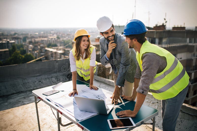 Group of Engineers, Architects, Business Partners at Construction Site ...