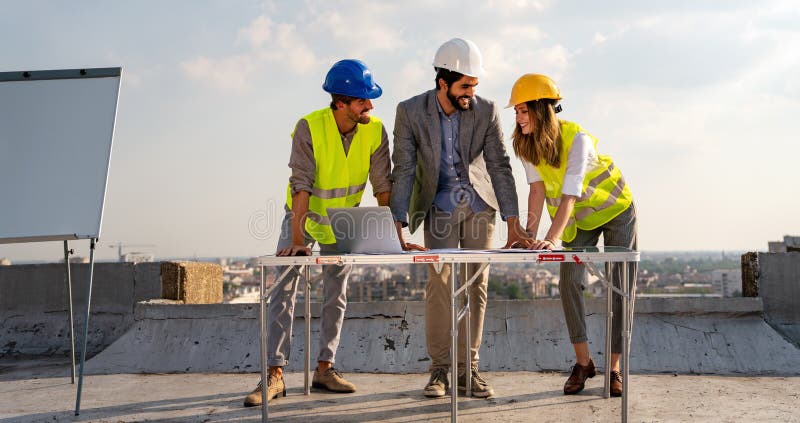 Group of Engineers, Architects, Business Partners at Construction Site ...
