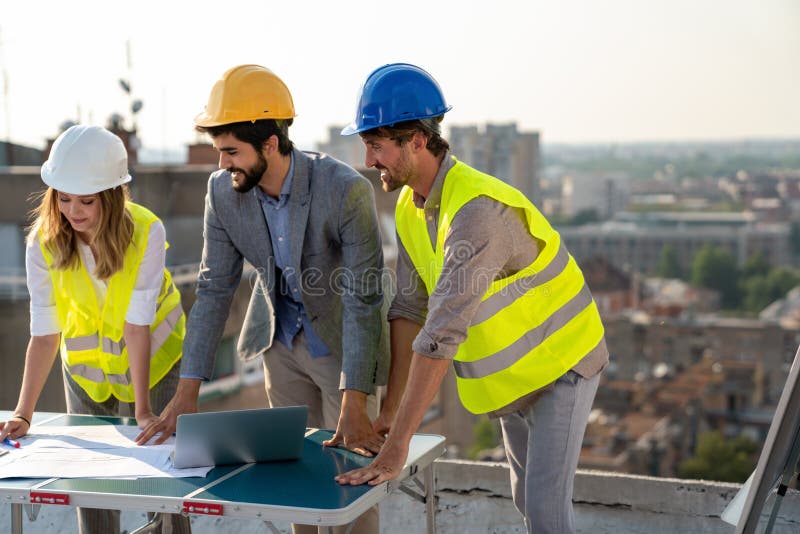 Group of Engineers, Architects, Business Partners at Construction Site ...