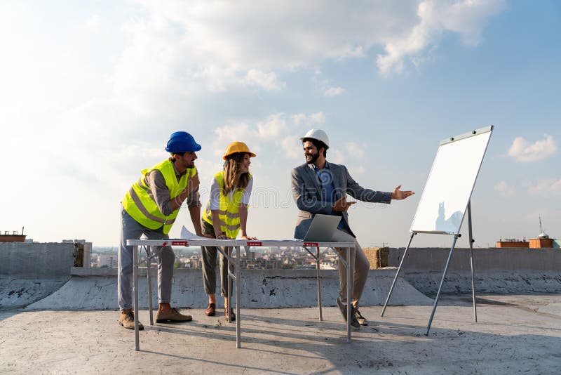 Group of Engineers, Architects, Business Partners at Construction Site ...