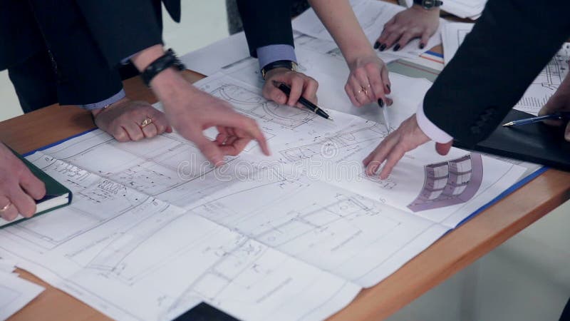 Group Engineers and Architects Discuss the Blueprint. Stock Footage ... Group Engineers and Architects Discuss the Blueprint. Stock Footage ...