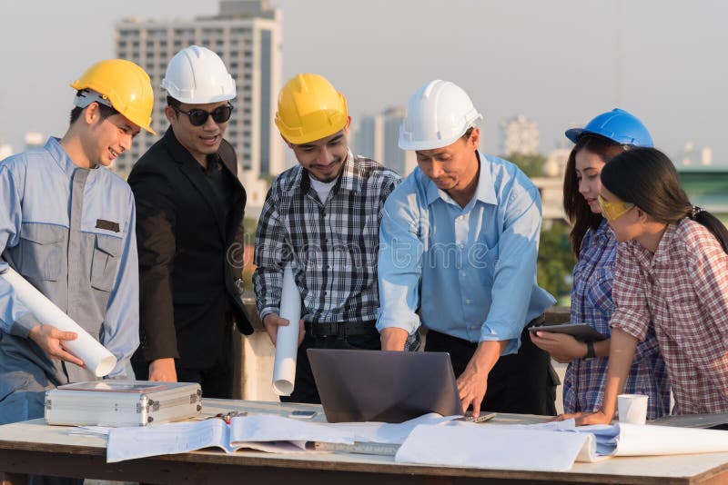 Group of Engineers and Architects Discuss at a Construction Site Stock ... Group of Engineers and Architects Discuss at a Construction Site Stock ...