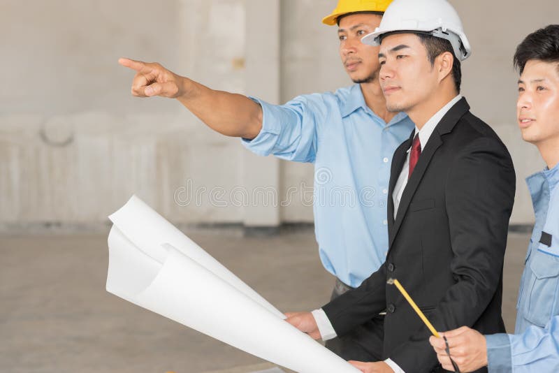 Group of Engineers and Architects Discuss at a Construction Site Stock ... Group of Engineers and Architects Discuss at a Construction Site Stock ...